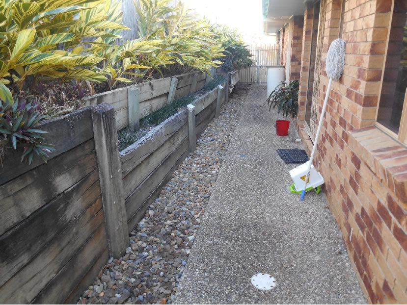 Hand Placed Sandstone Retaining Wall Transformation in Arundel, QLD ...