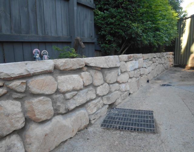 Hand Placed Sandstone Rock Wall Installation in Carrara – Gold Coast ...