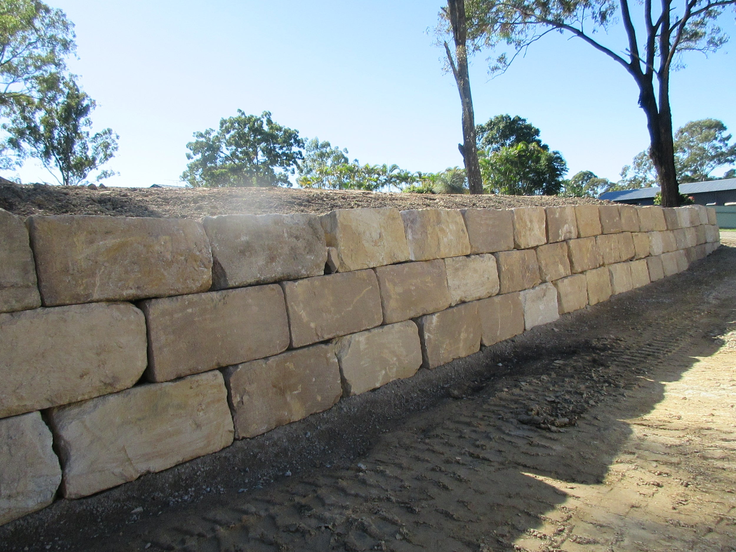 B Grade Sandstone Boulder Retaining Wall in Nerang - Industrial Shed ...